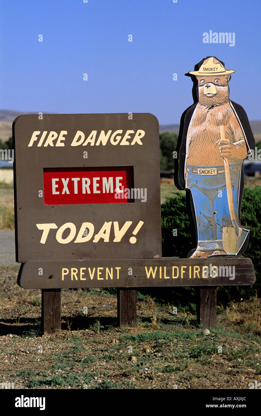 A forest service sign with Smokey Bear warning of extreme fire danger ...