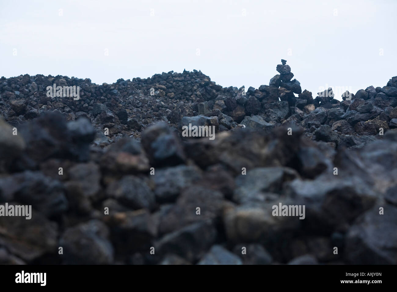 Volcanic lava rocks stacked up near the Hawaii Southeast coast near ...