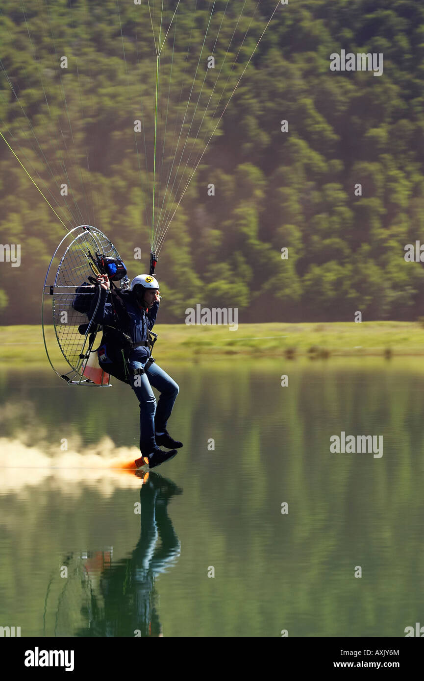 Paramotor skimming water Diamond Lake Paradise near Glenorchy ...