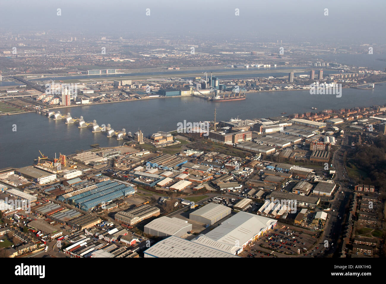 High level oblique aerial view north east of Thames Barrier and City ...