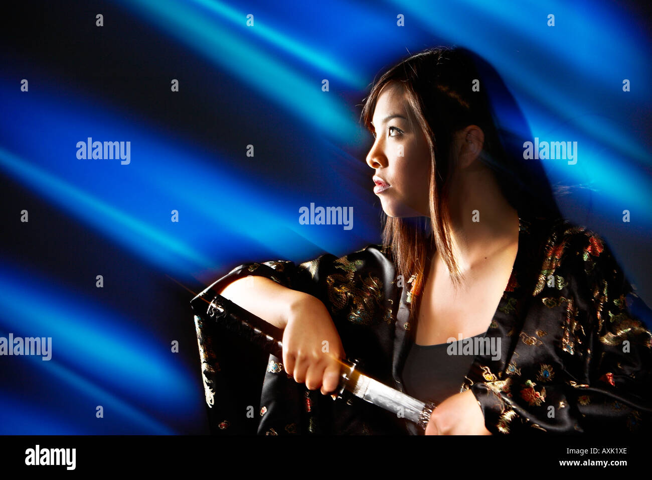 Asian warrior fighting girl woman lady with sword looking up hair silk ...
