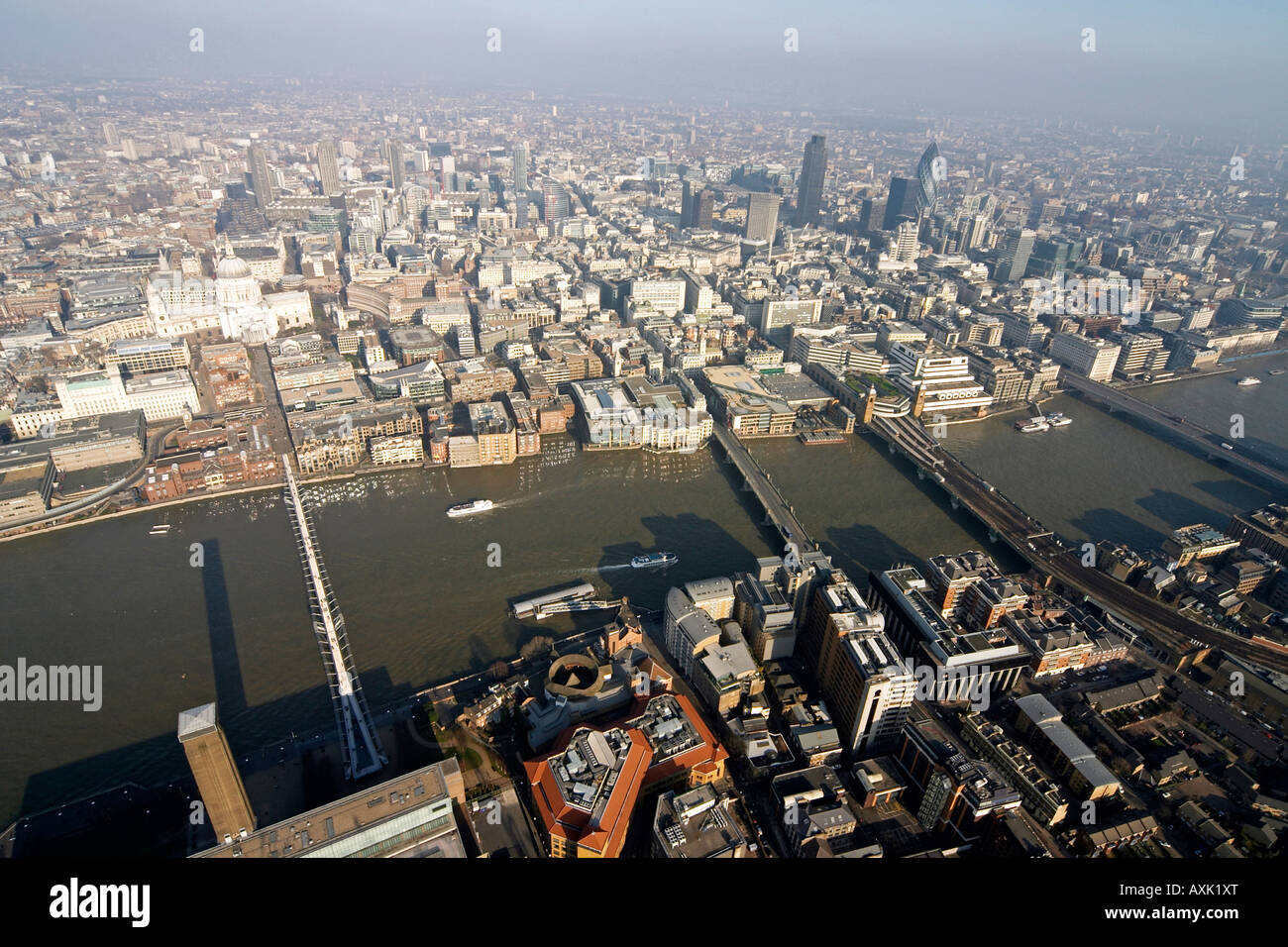 High level oblique aerial view north of River Thames and City of London ...