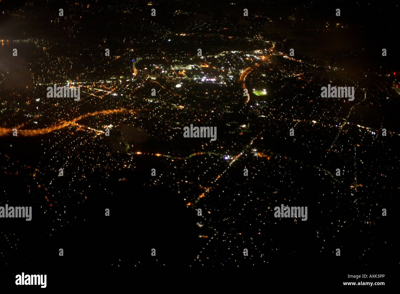 High level oblique aerial view at night from commercial aircraft of ...
