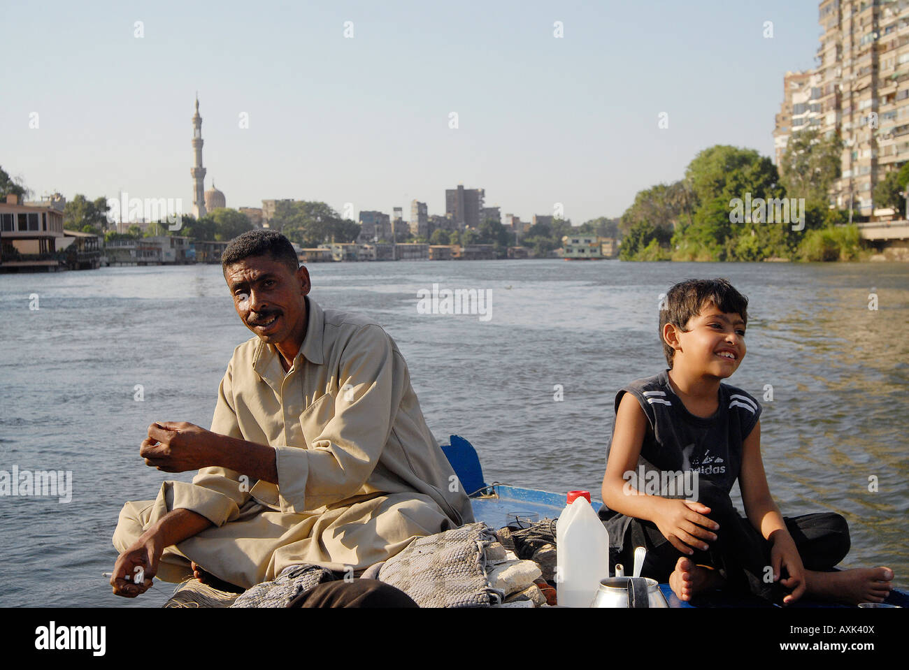 Father and son are enjoying a happy afternoon on the Nile Stock Photo ...