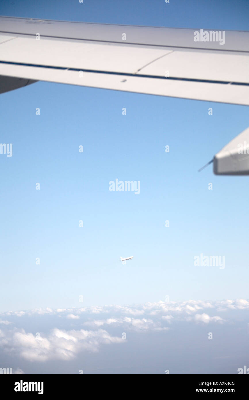Aerial view of aircraft in flight in blue sky from the air viewed from ...