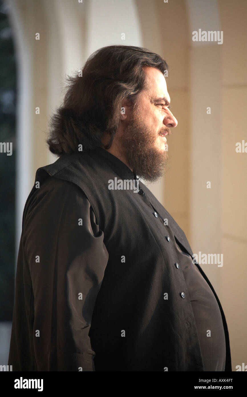 Priest in evening light outside before Easter Good Friday evening ...