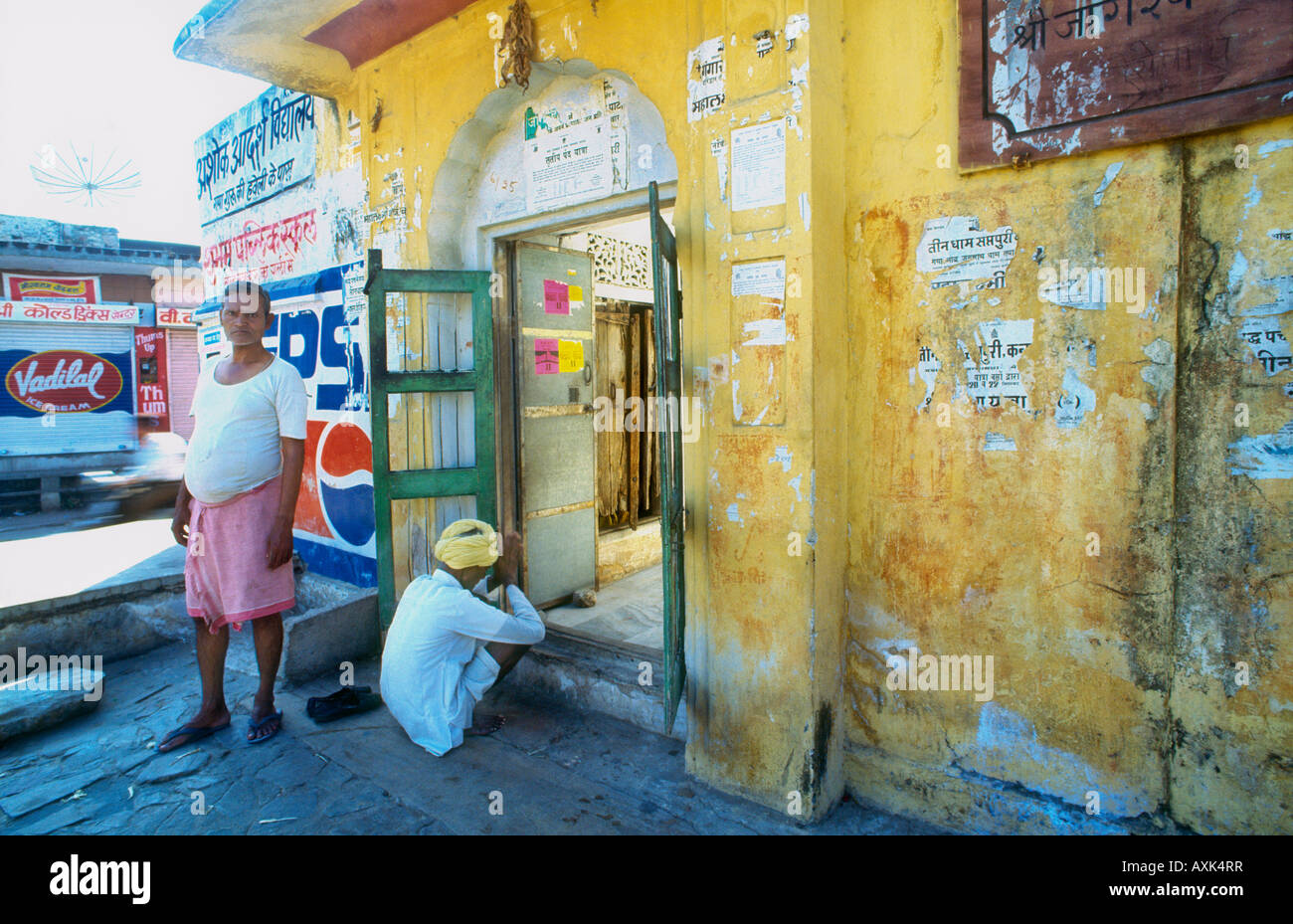 Indian Hindu man crouched at doorstep of holy place in prayer Jaipur ...