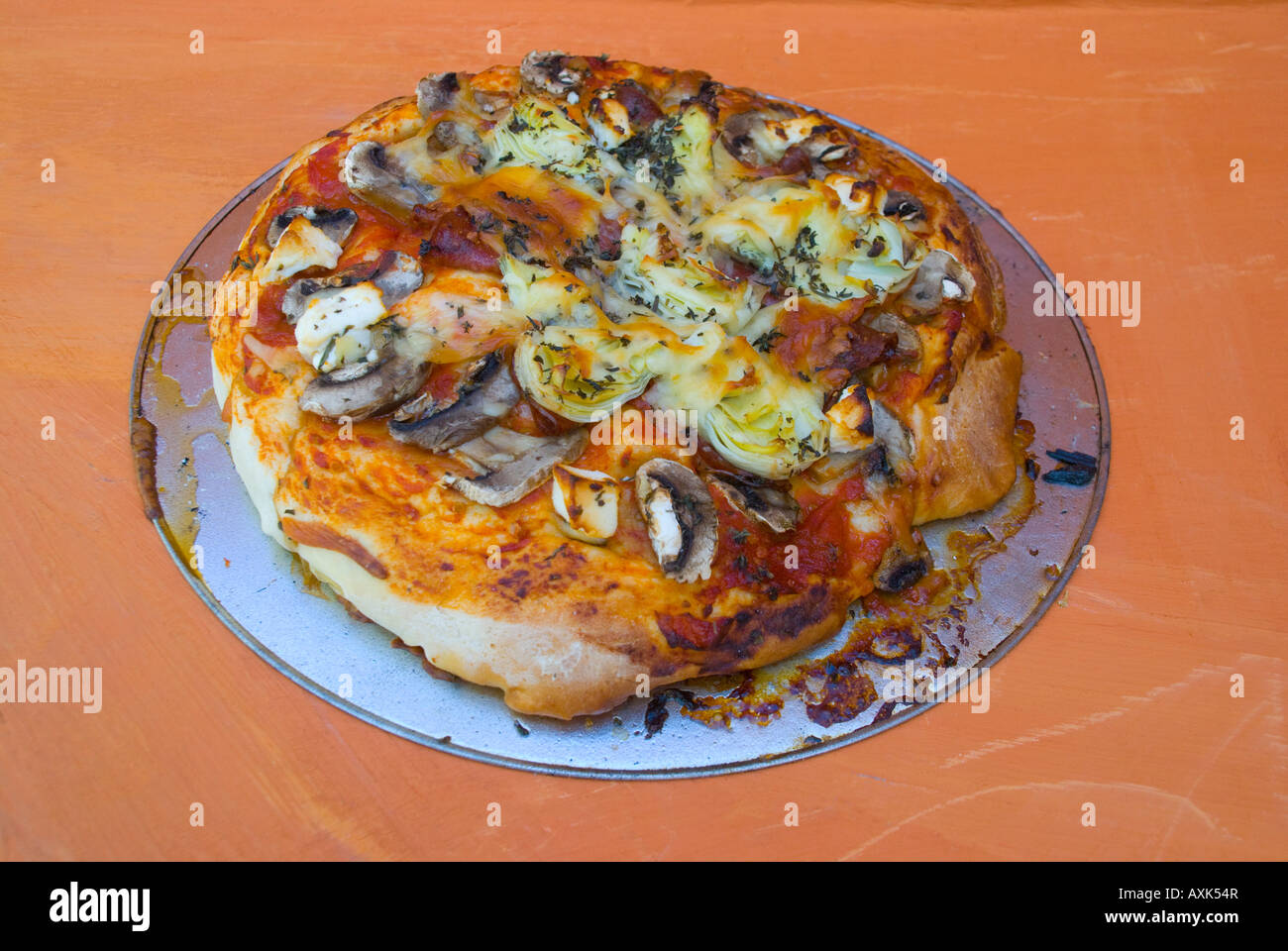 High crust pizza baked in outdoor wood fired oven Stock Photo - Alamy