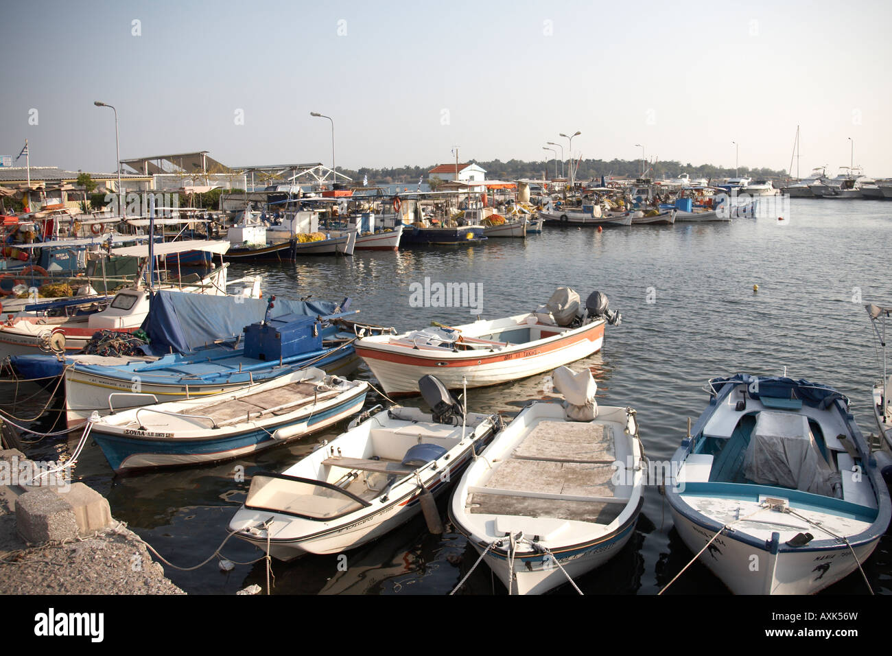 Fishing boats and small ships in the harbour port with fish restaurants ...