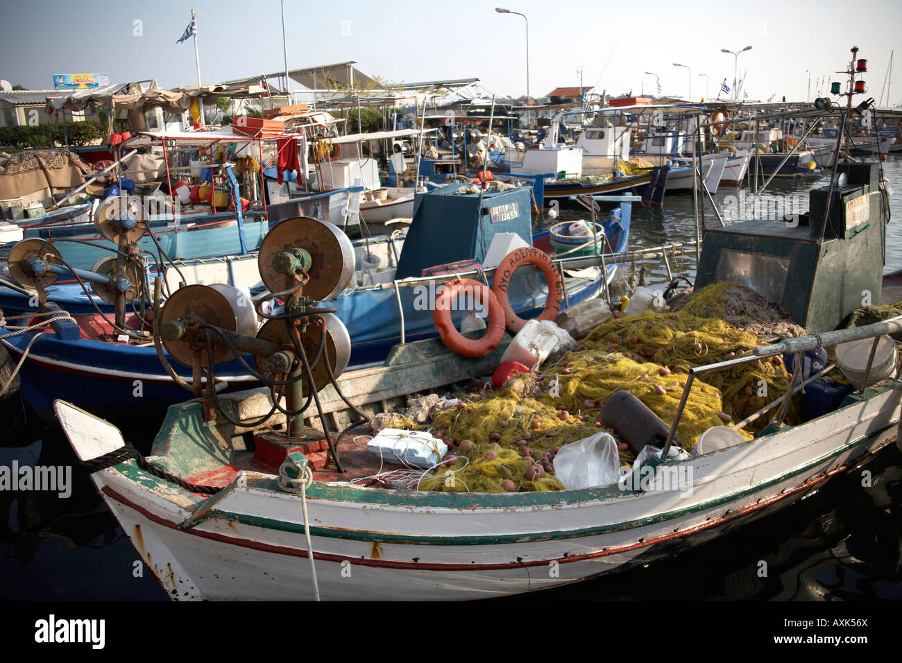 Fishing boats and small ships in the harbour port with fish restaurants ...