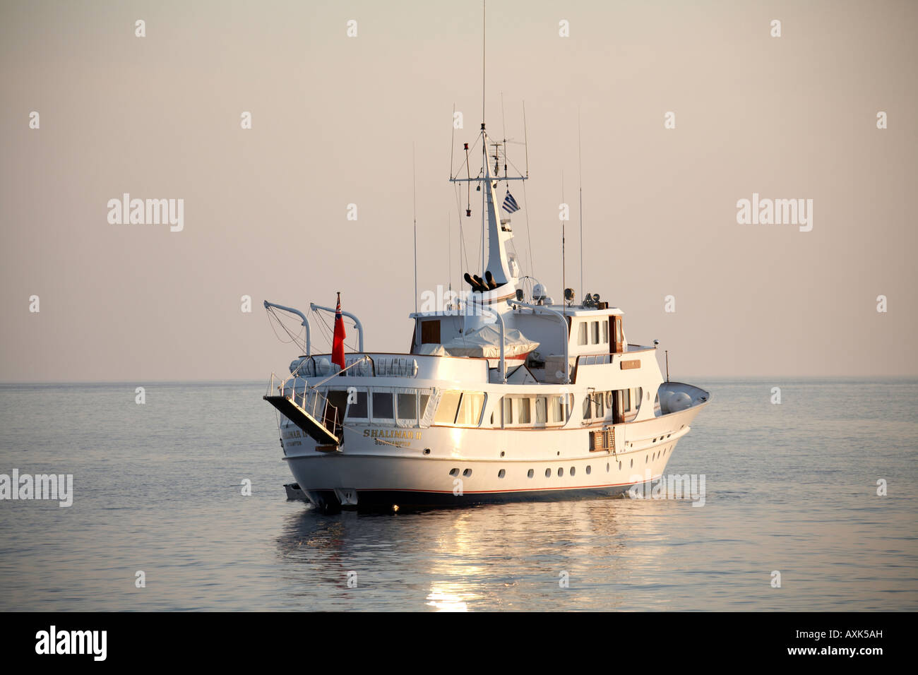 Shalimar II motor yacht or cruiser in evening sunlight moored in calm ...