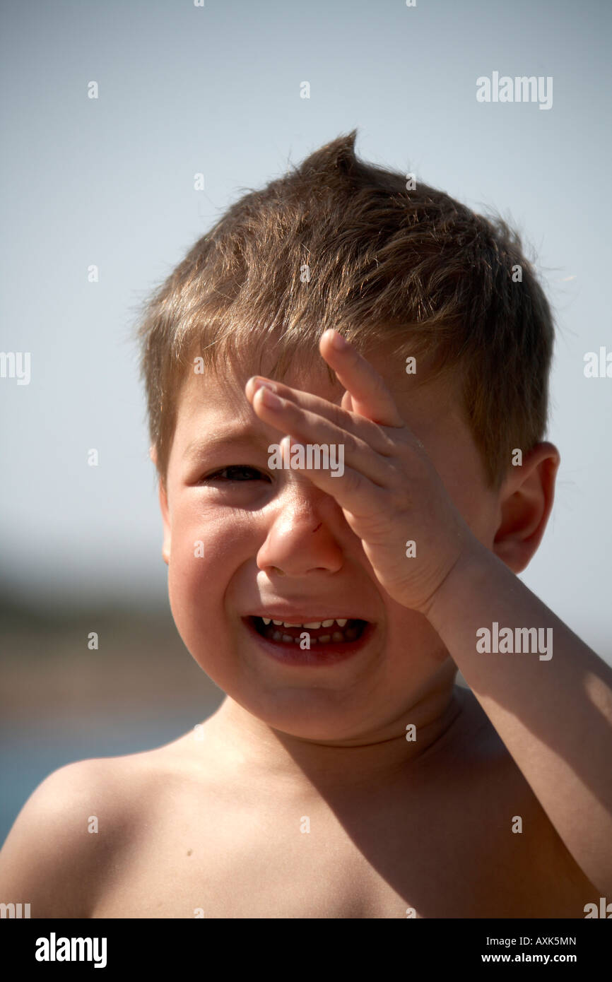 Young boy child miserable unhappy sad crying CJWH Stock Photo - Alamy