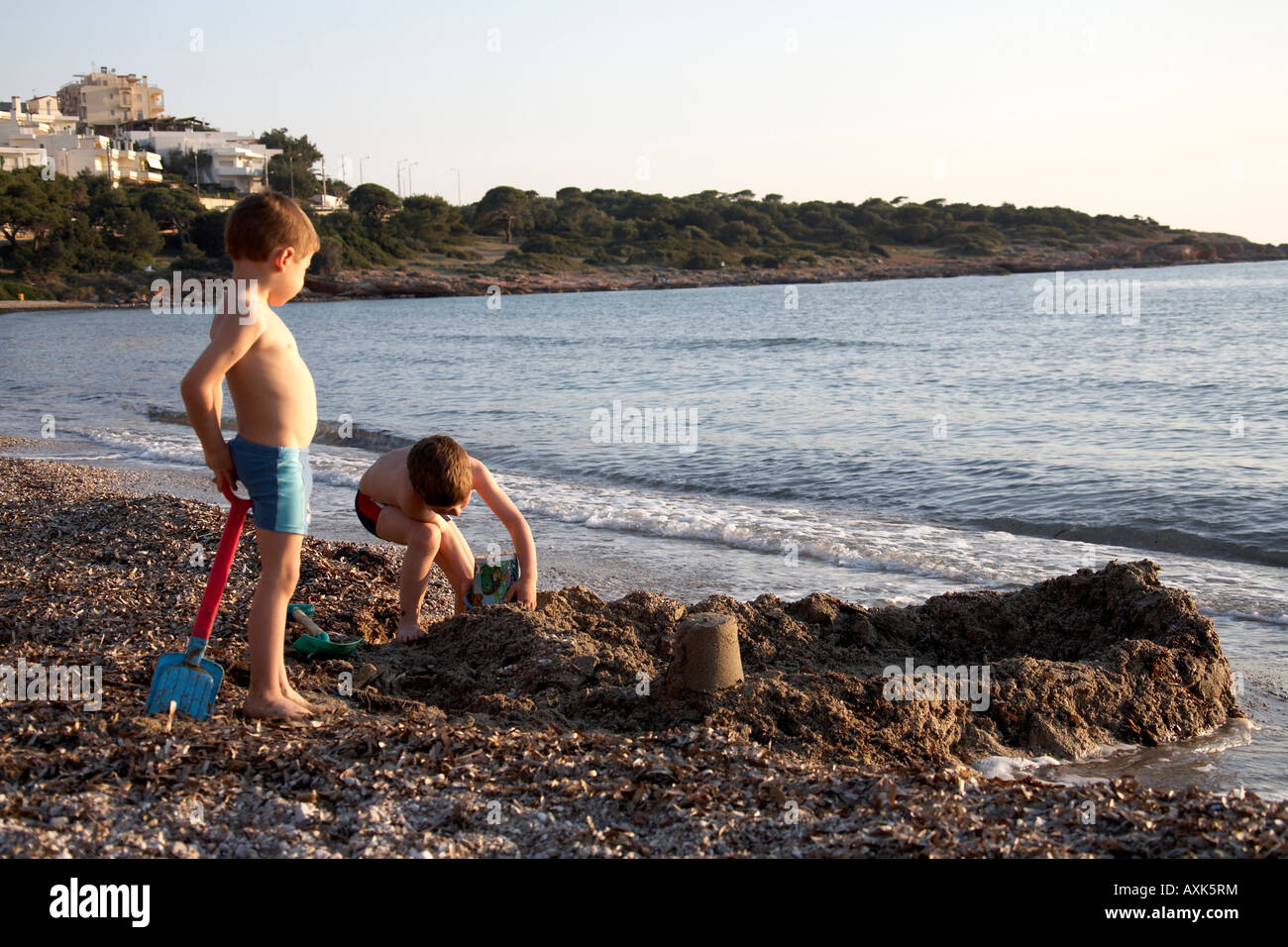 Boys Building Sand Castle High Resolution Stock Photography and Images ...