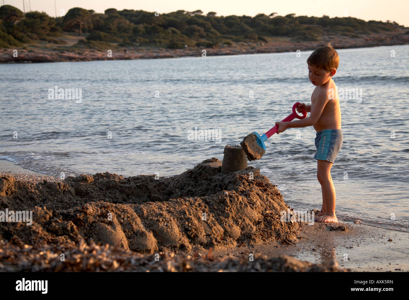 Child Boy Digging Sand On High Resolution Stock Photography and Images ...