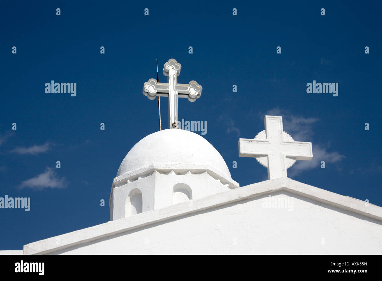 Dome and cross of Agios Georgios church against blue sky on Likavitos ...