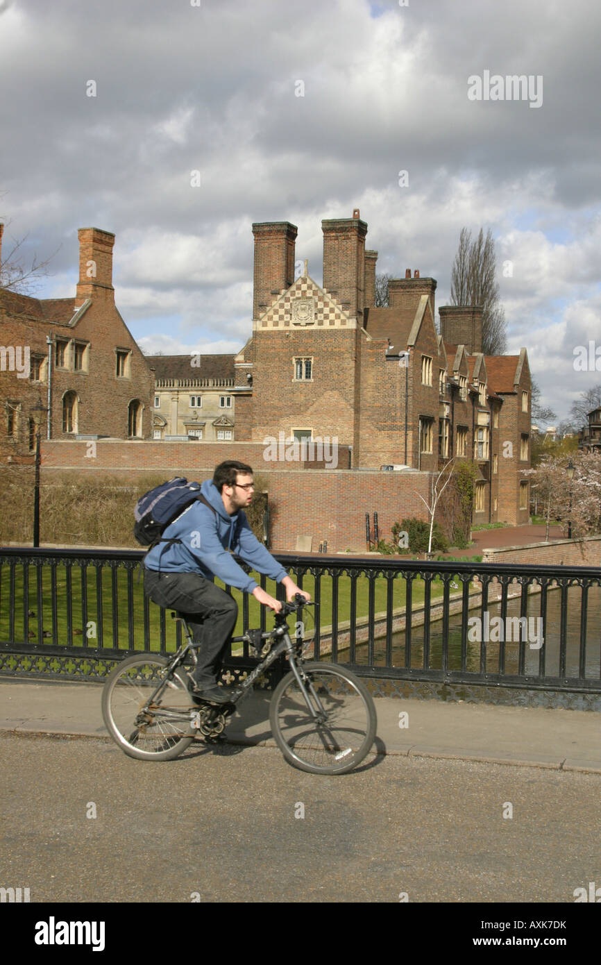 A student cycling over the bridge over the River Cam on Magdalene ...