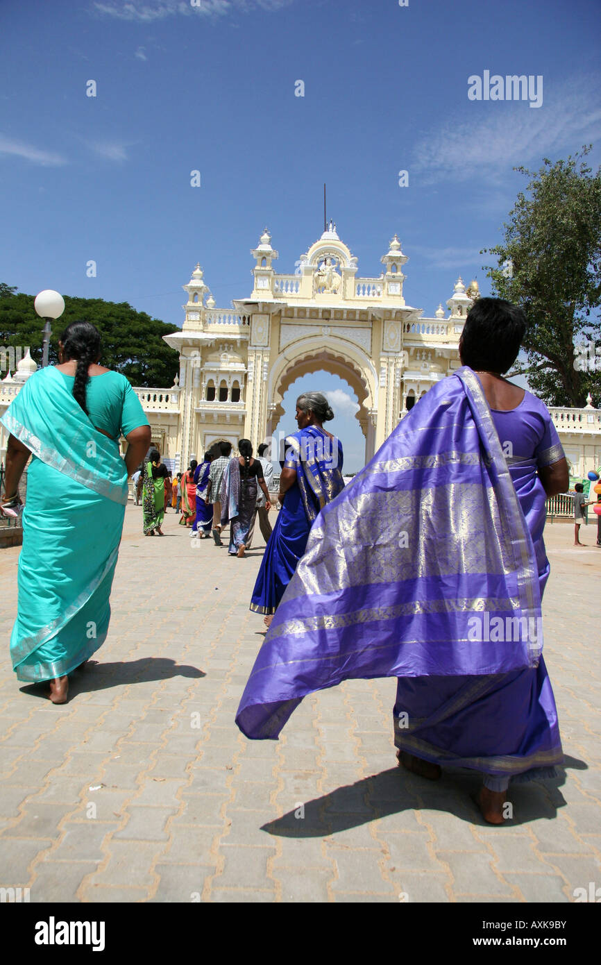 A group of Indian women are about to enter the grounds of Mysore's Amba ...
