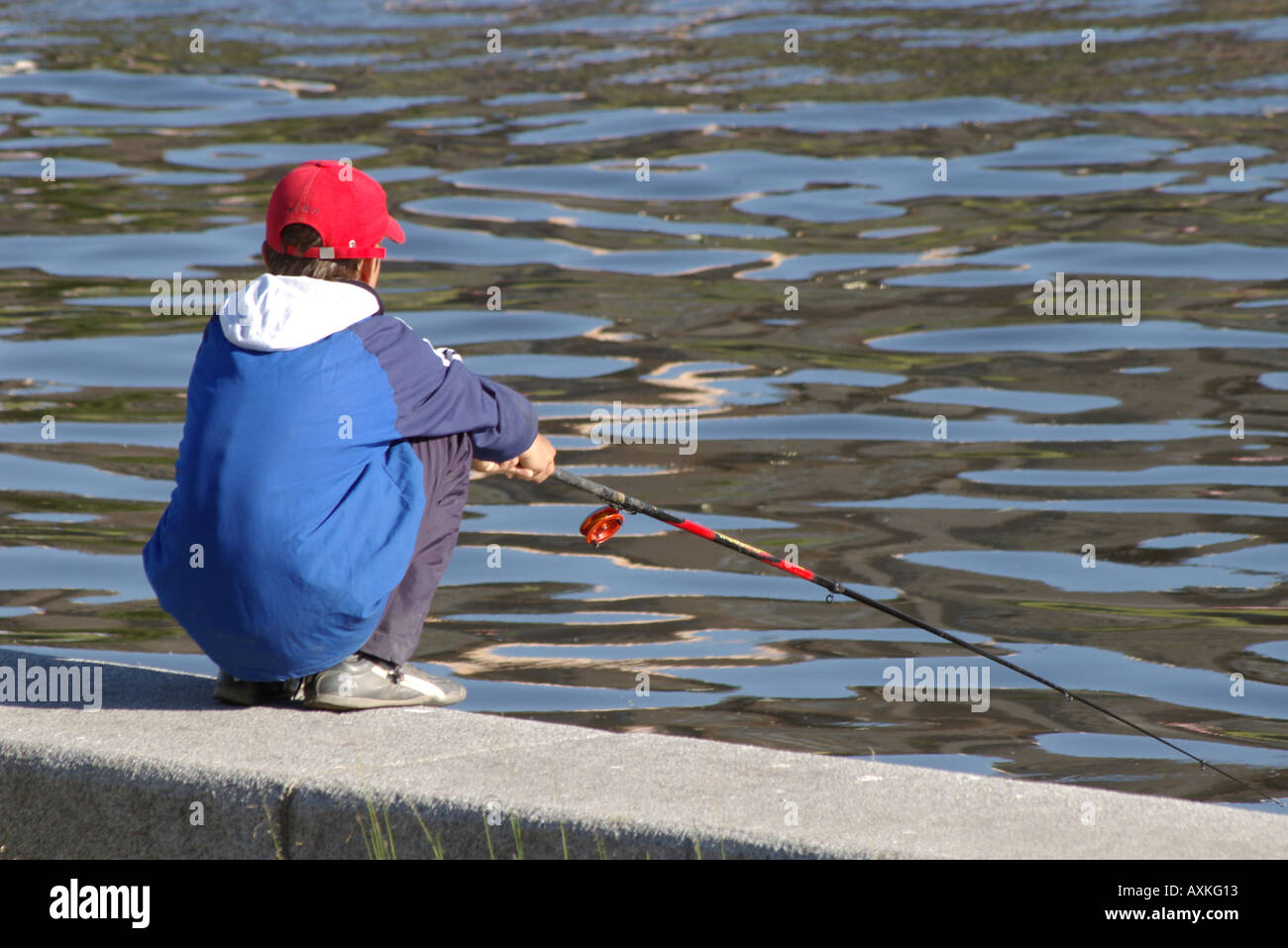 A boy fishing Stock Photo - Alamy