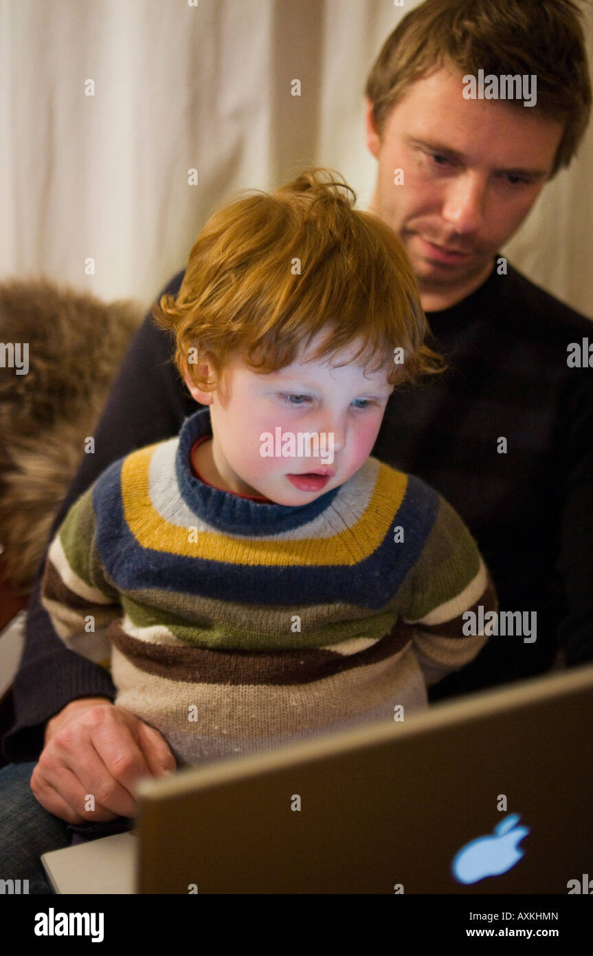 Using laptop children lap hi-res stock photography and images - Alamy