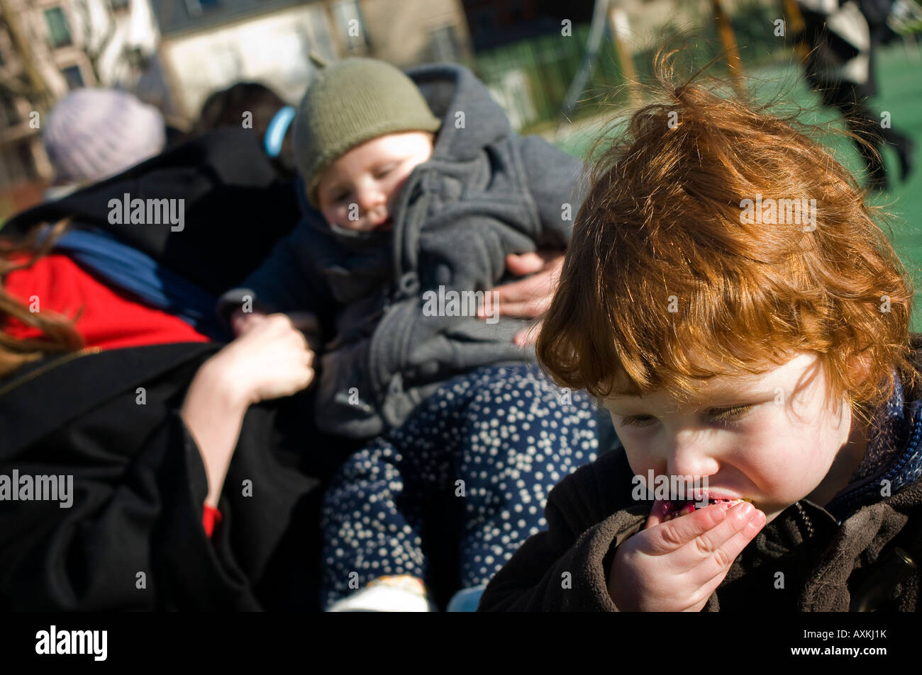 Young boy eating Stock Photo - Alamy