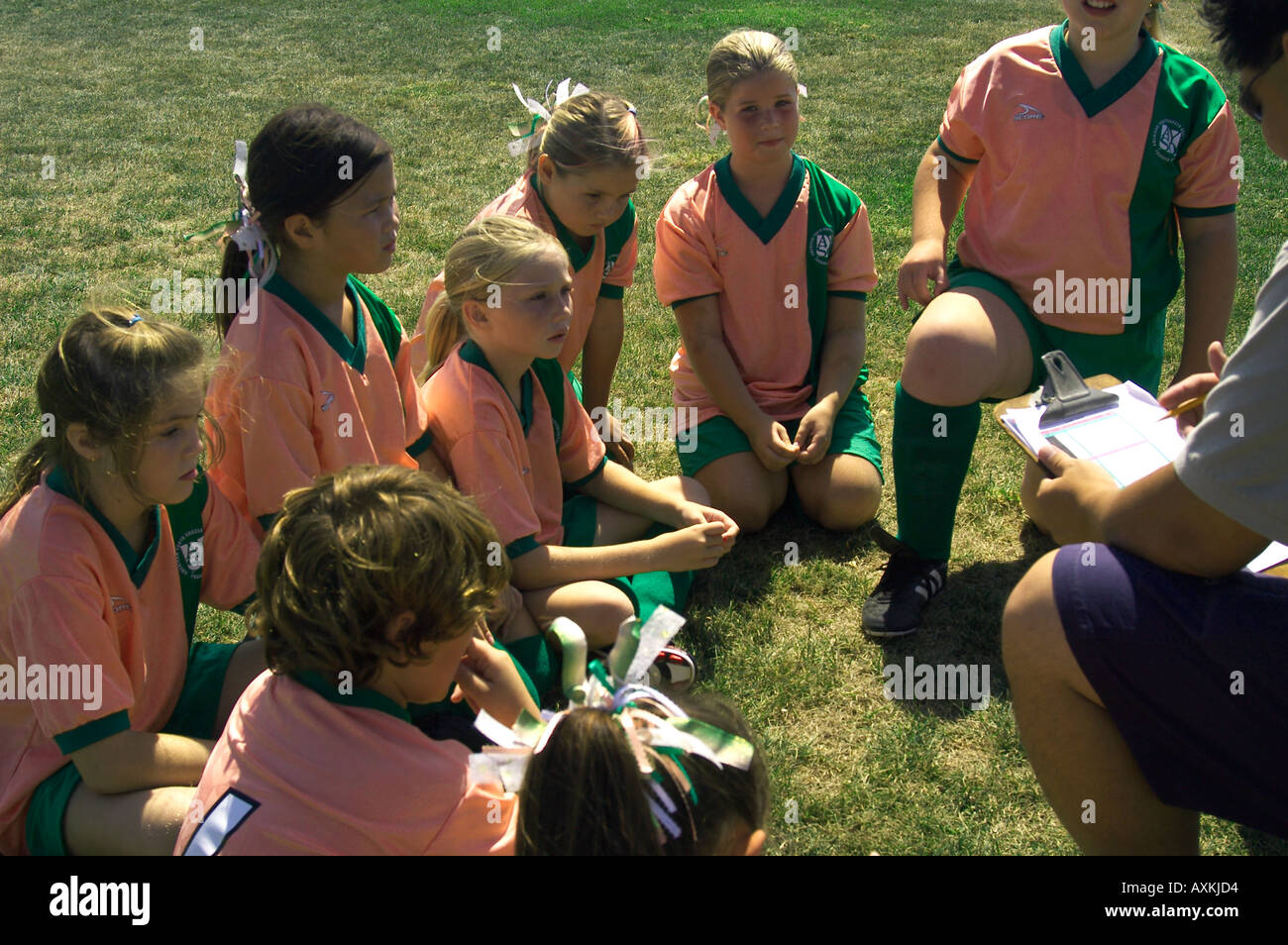girls listening to coach Stock Photo - Alamy
