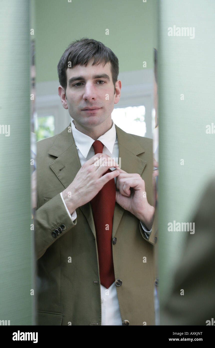 ymbols of application A young man prepares himself for a job interview ...