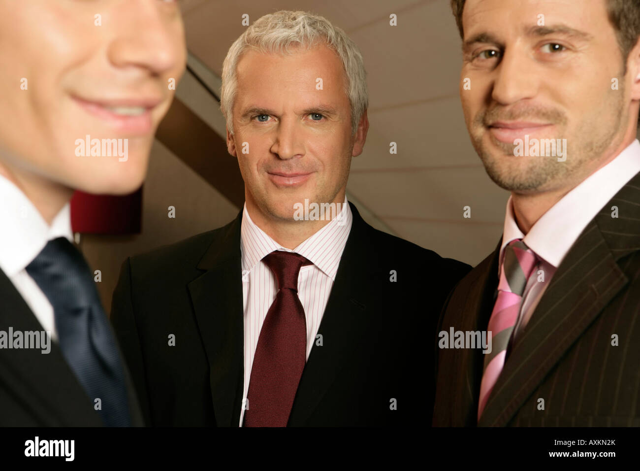 Group of three businessmen Stock Photo - Alamy