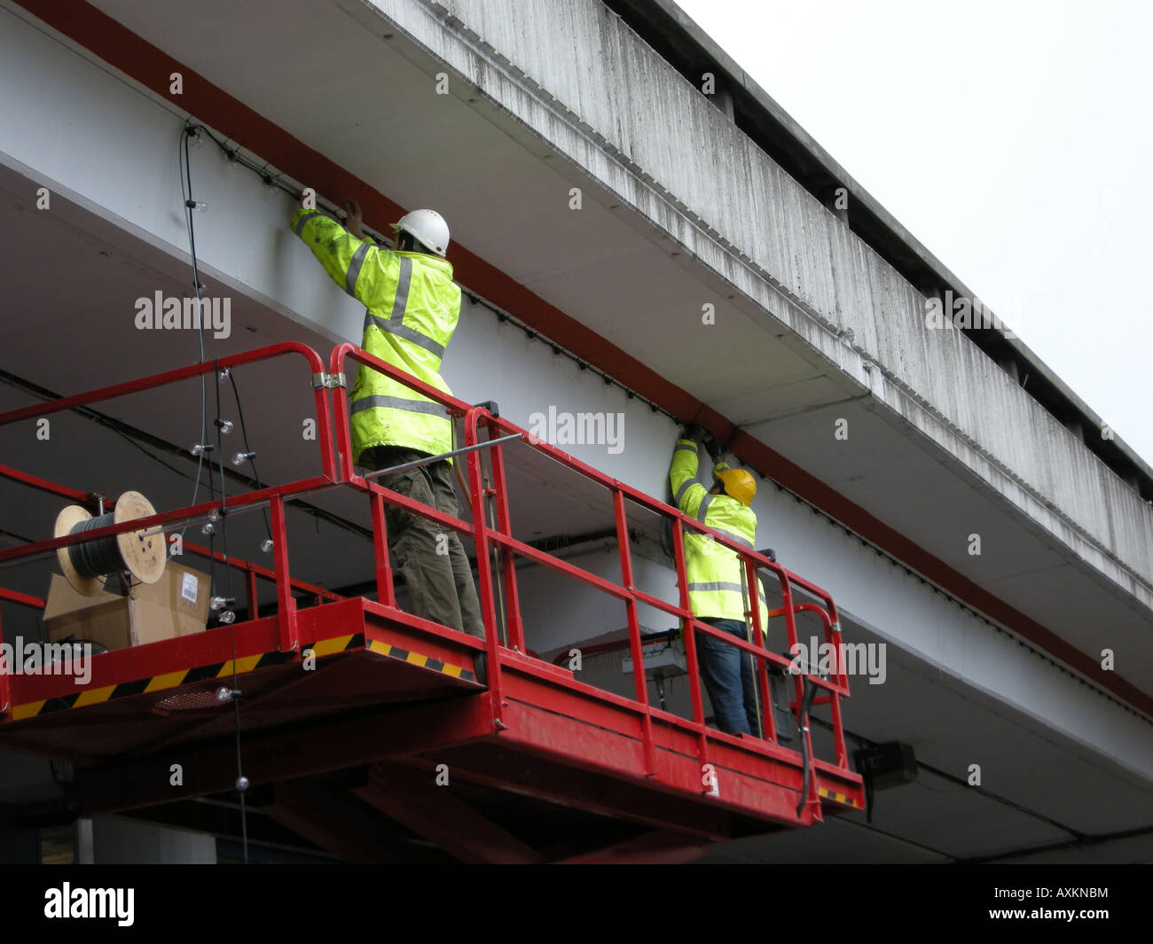 Construction workers working on a flyover Stock Photo - Alamy
