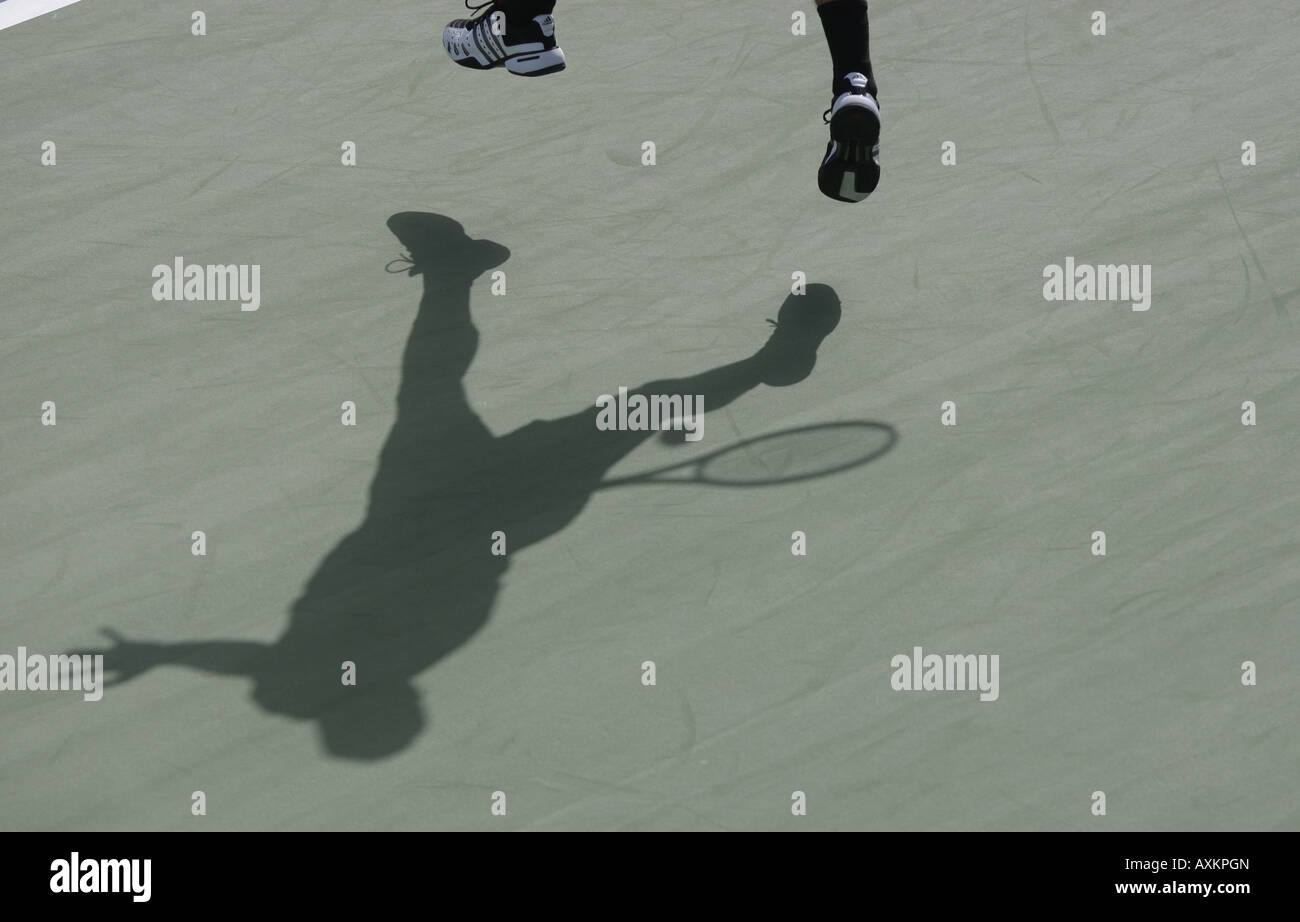 Elevated view of the shadow of a male tennis player Stock Photo - Alamy