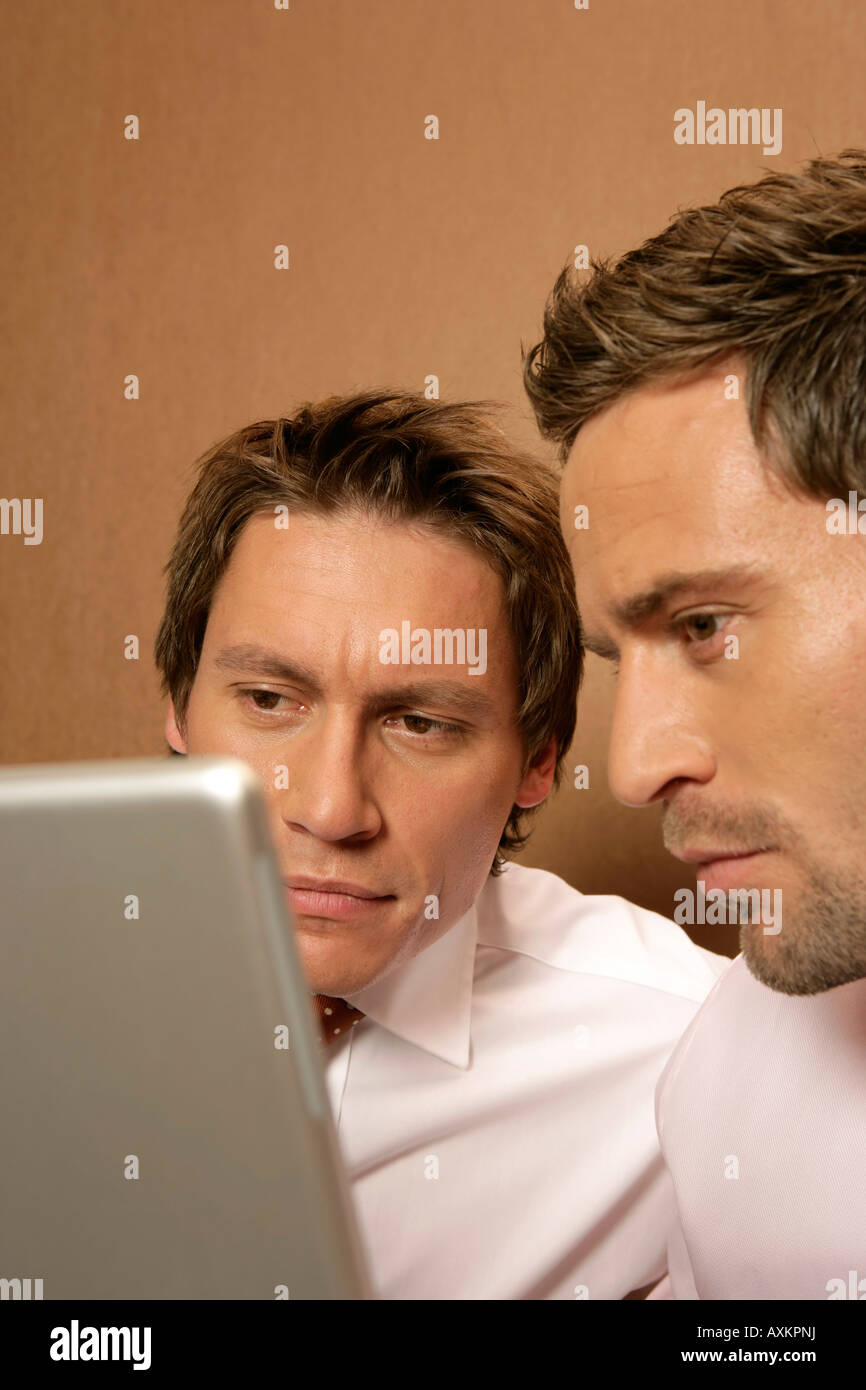 Two businessmen using laptop Stock Photo - Alamy