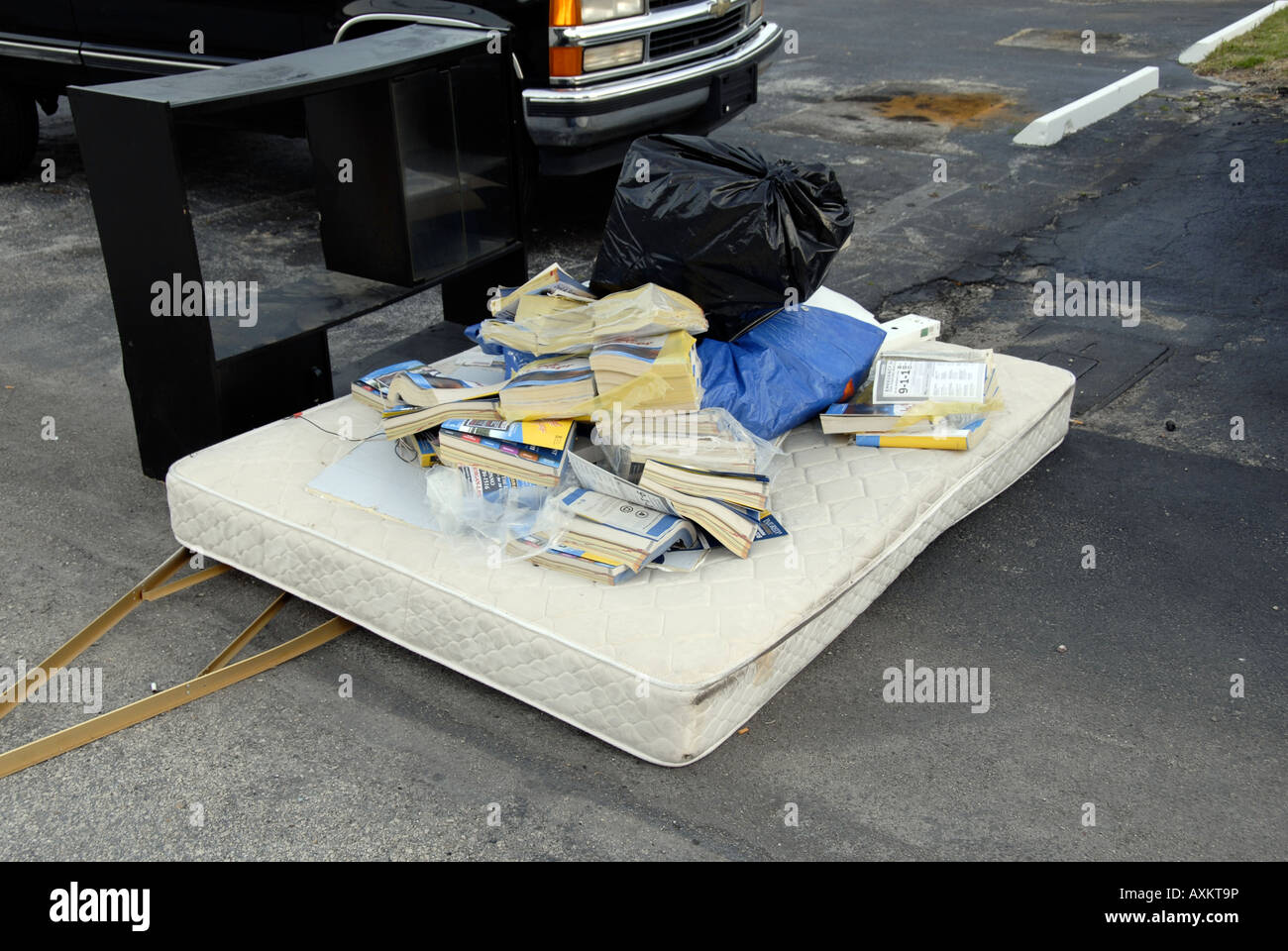 Discarded stuff on sidewalk Stock Photo - Alamy