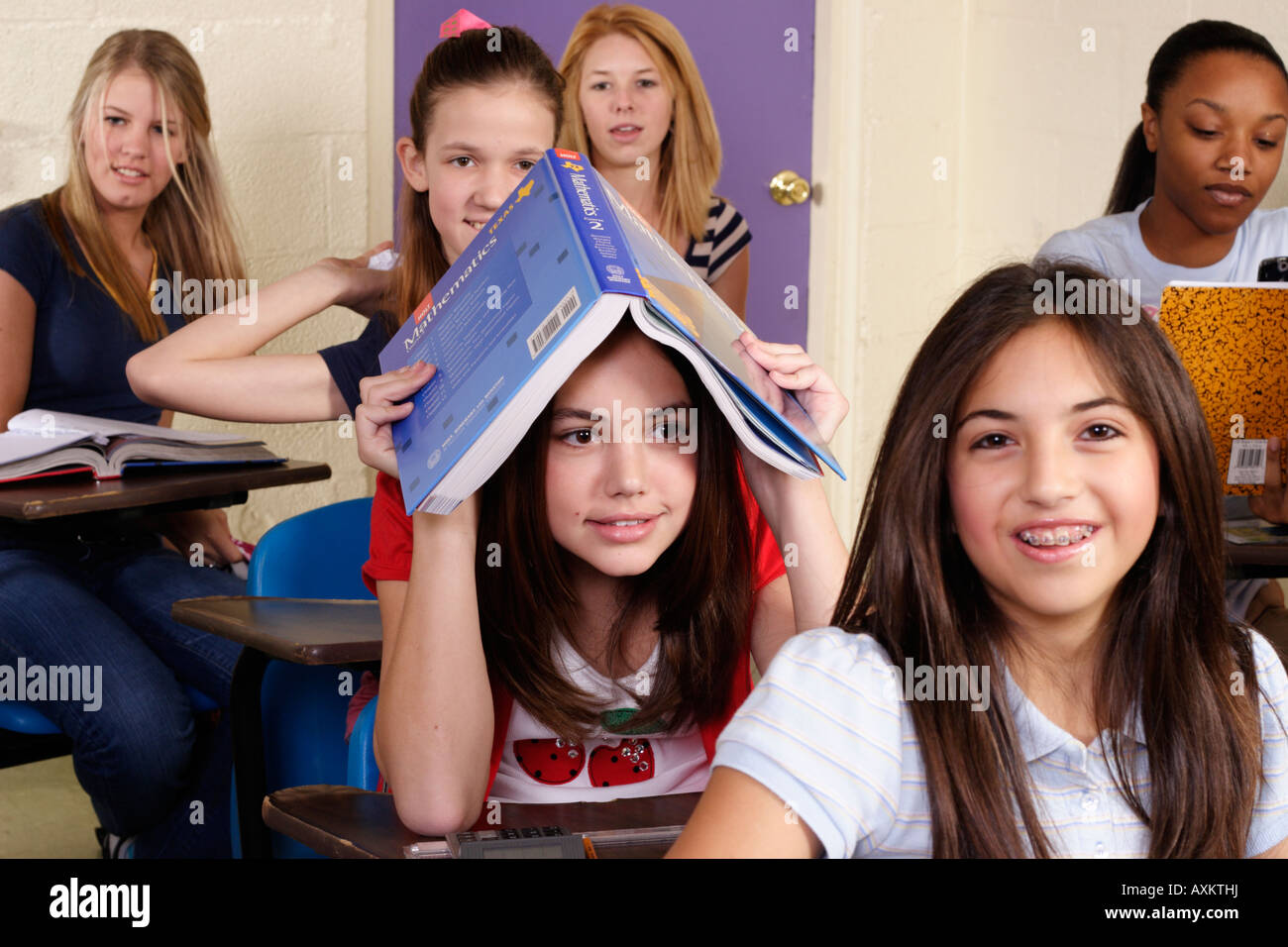 Stock Photogaph of a student in class about to throw a wad of paper ...