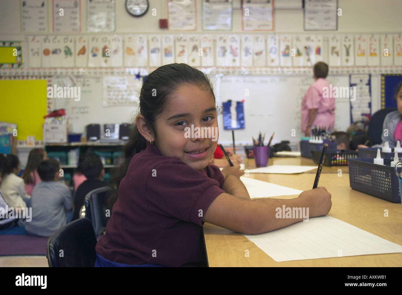 Hispanic girl in class Stock Photo - Alamy