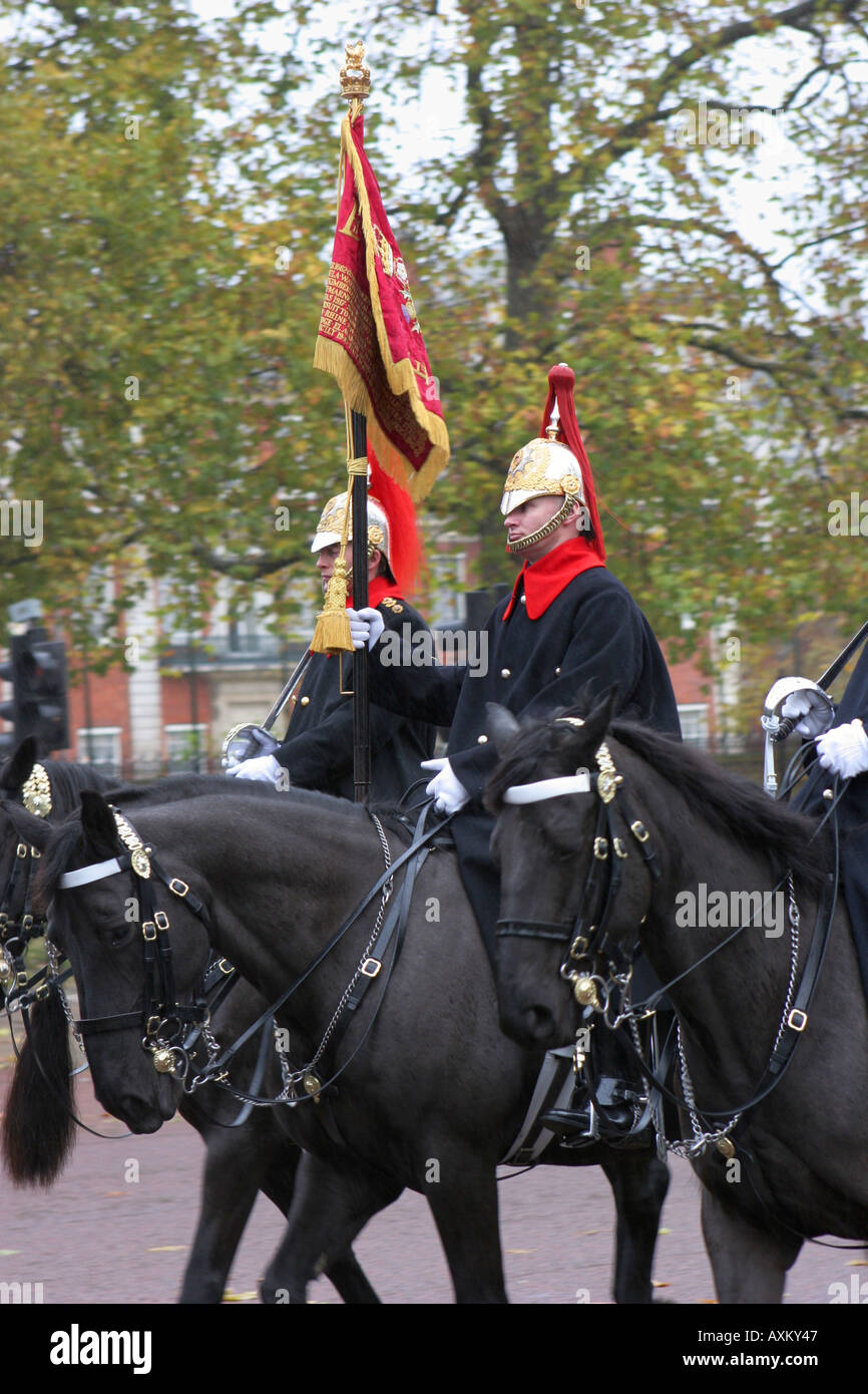 Two Horse Guards, one carrying the regimental banner at the changing of ...
