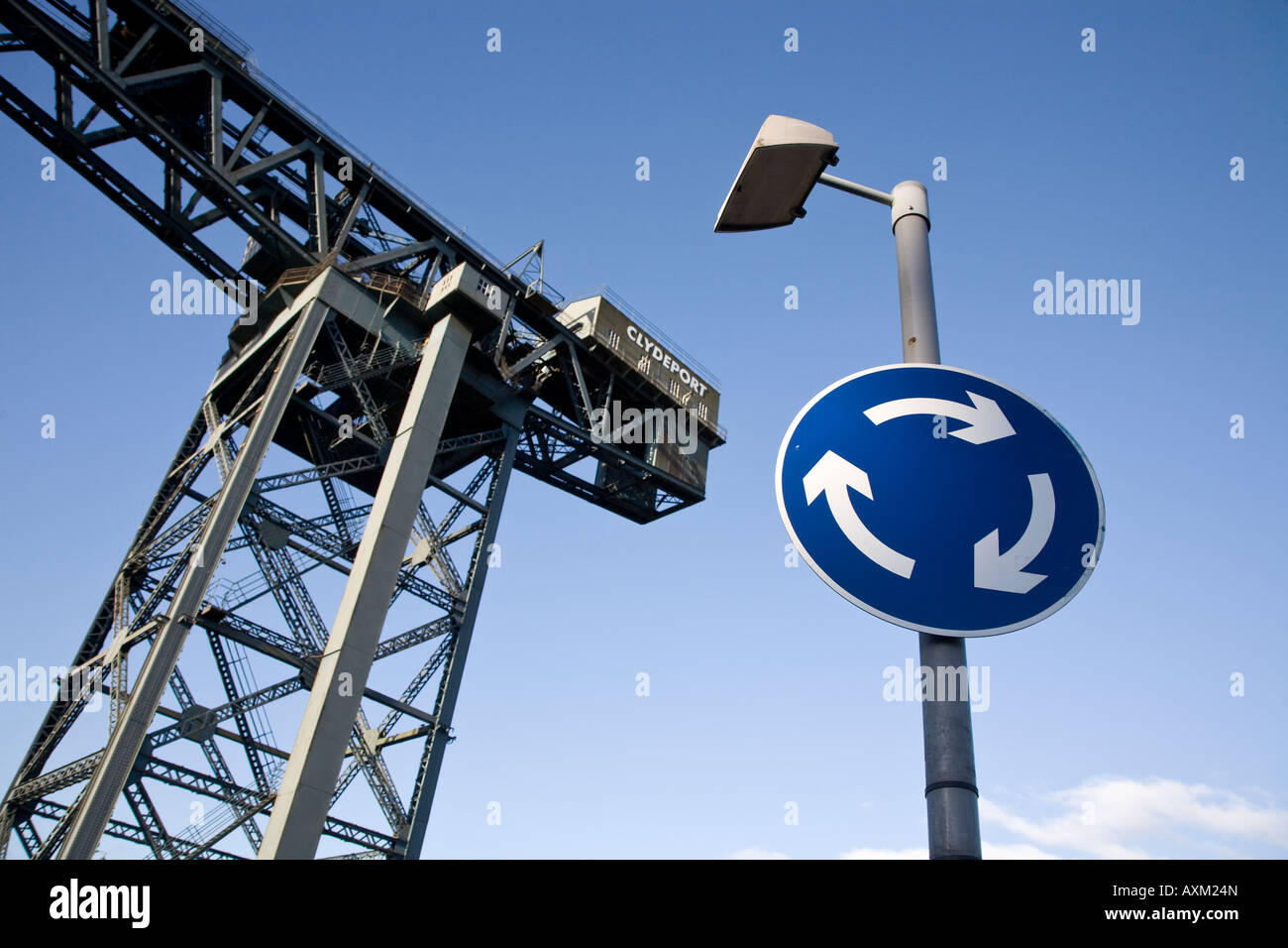 A roundabout sign against The Clyde Navigation Trustees number 7 crane ...
