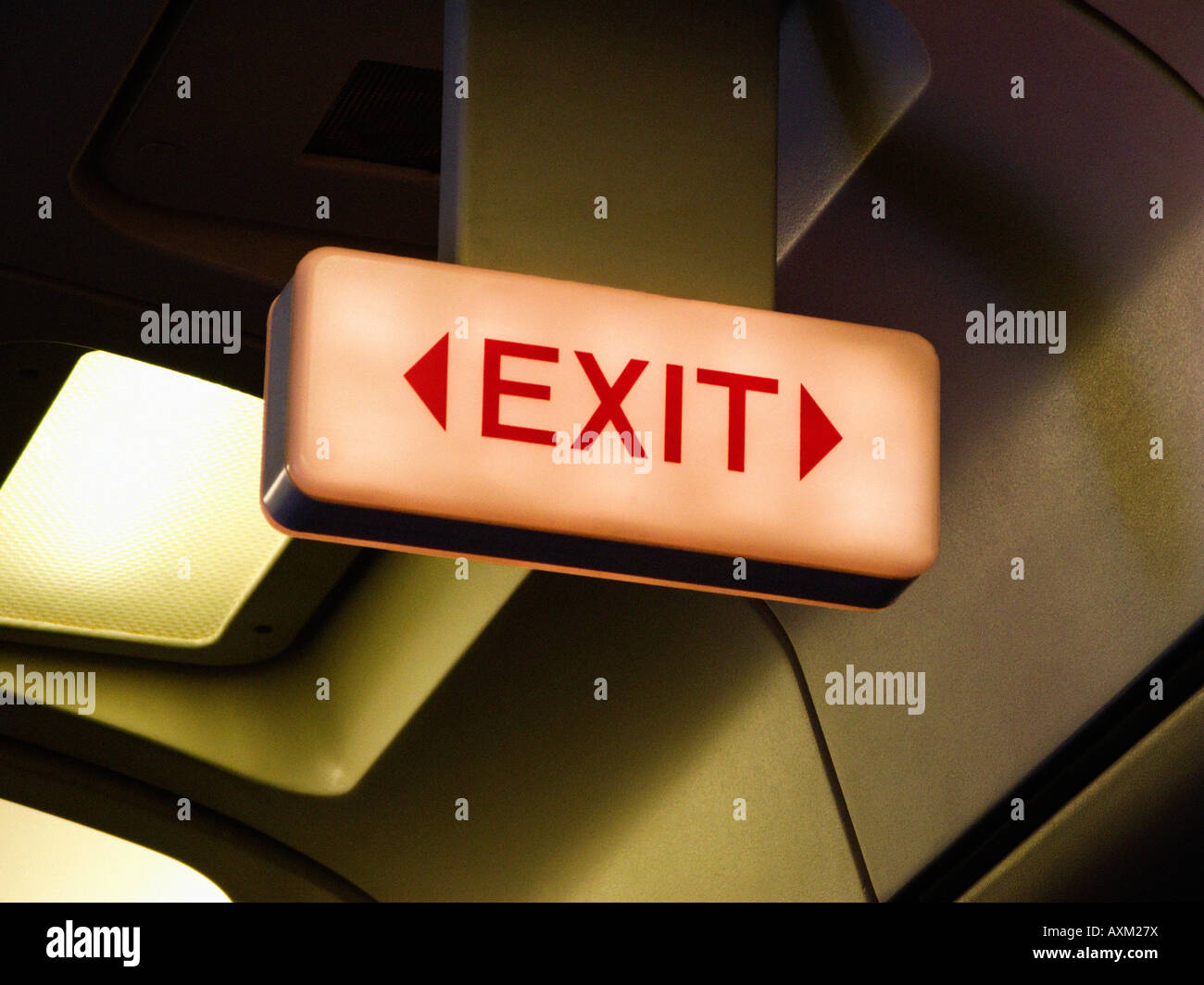 Exit sign on aircraft Stock Photo - Alamy