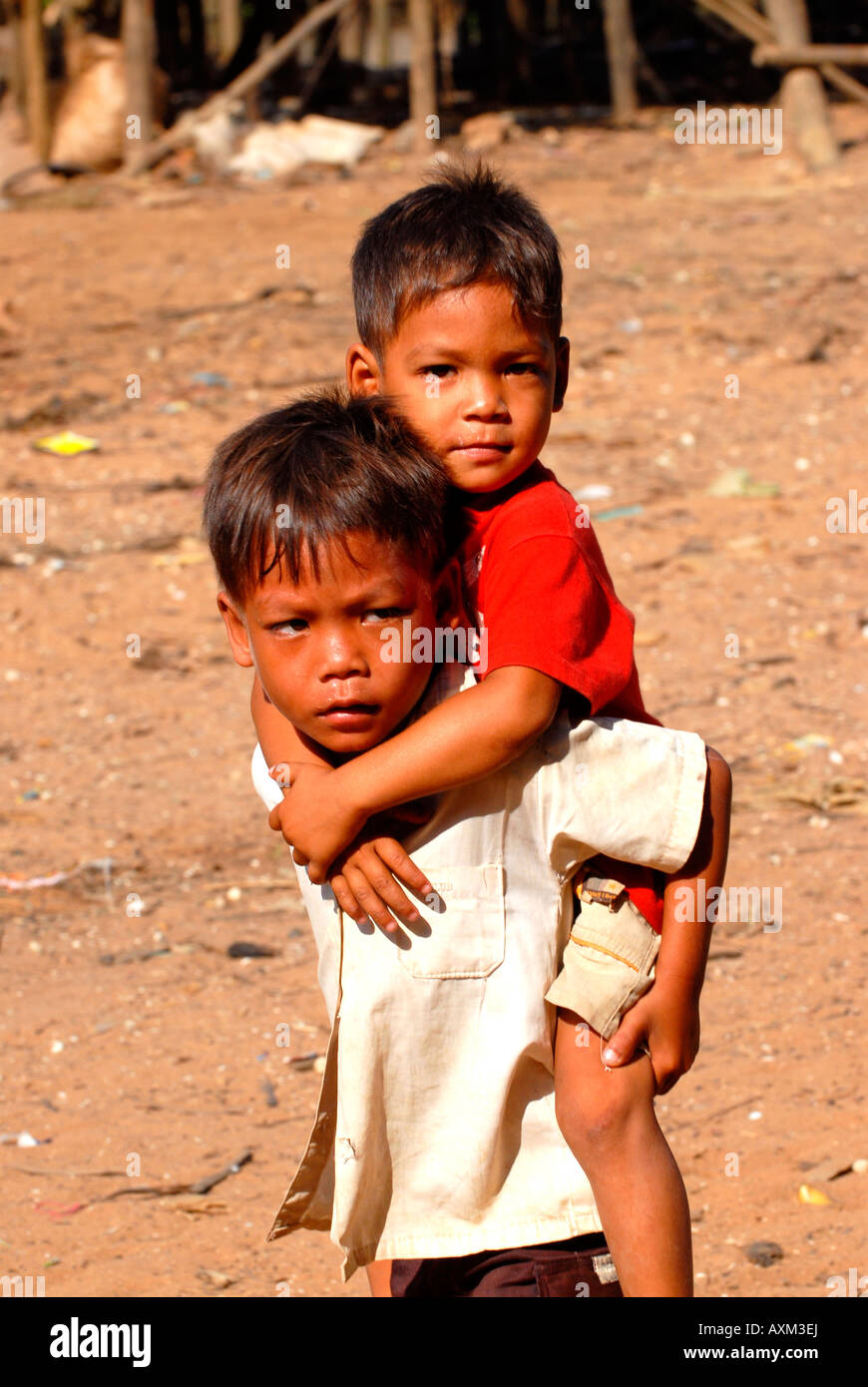 Cambodia ,Tonle Sap Lake , typical poor village scene of young boy ...