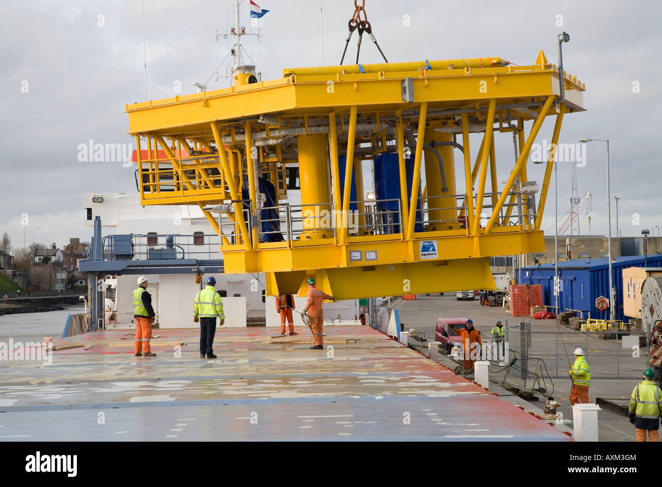 Rig platform being loaded onto container ship at Yarmouth Stock Photo ...