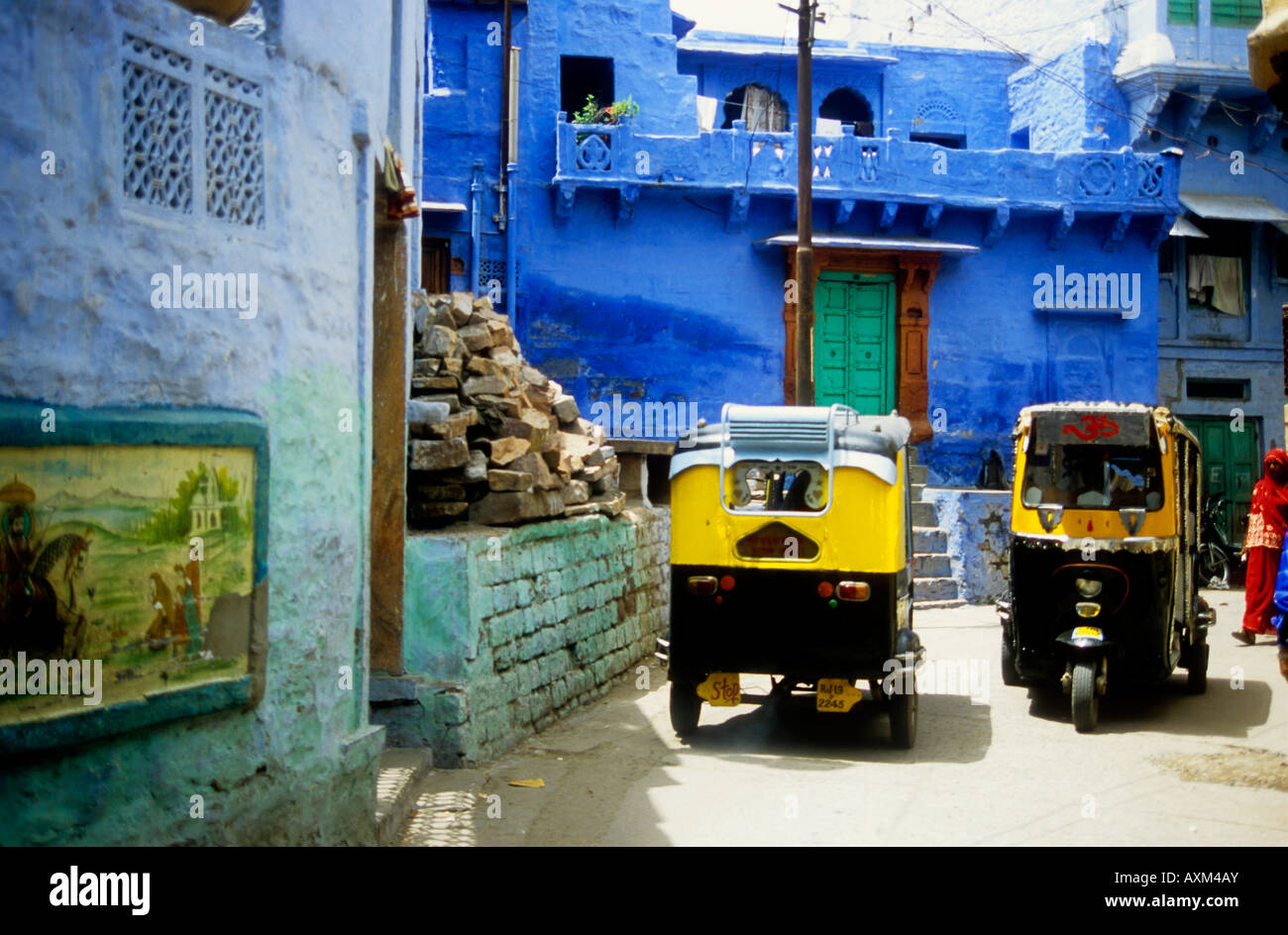 Auto rickshaws in front of a blue house in Jodhpur in India Stock Photo ...