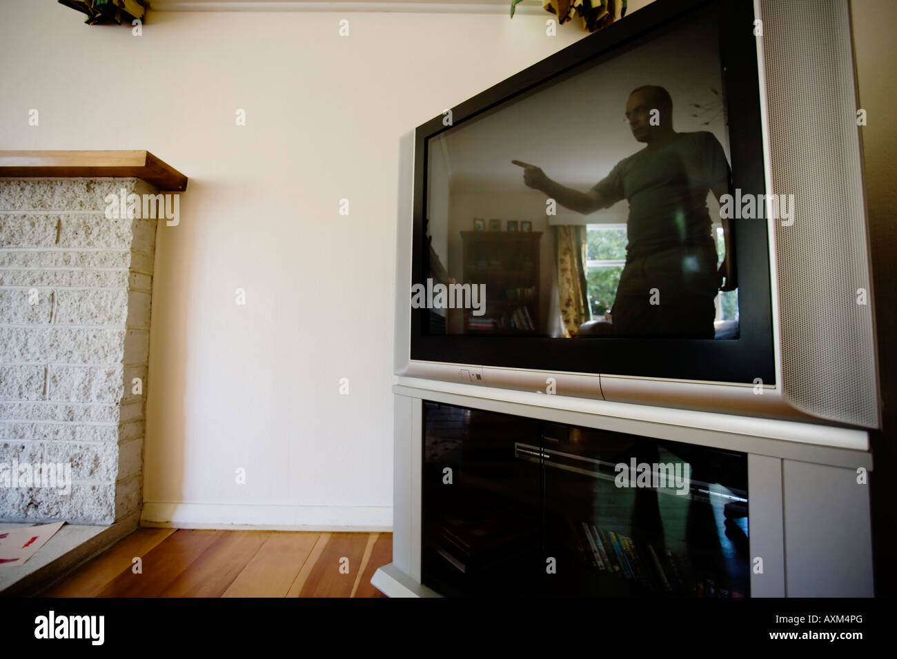 Tv switched off with man in home reflected in the blank screen Stock ...