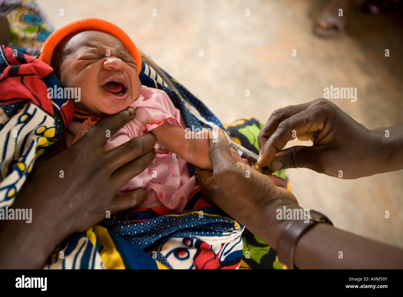 A child receives vaccination against tuberculosis, Benin, Africa Stock ...