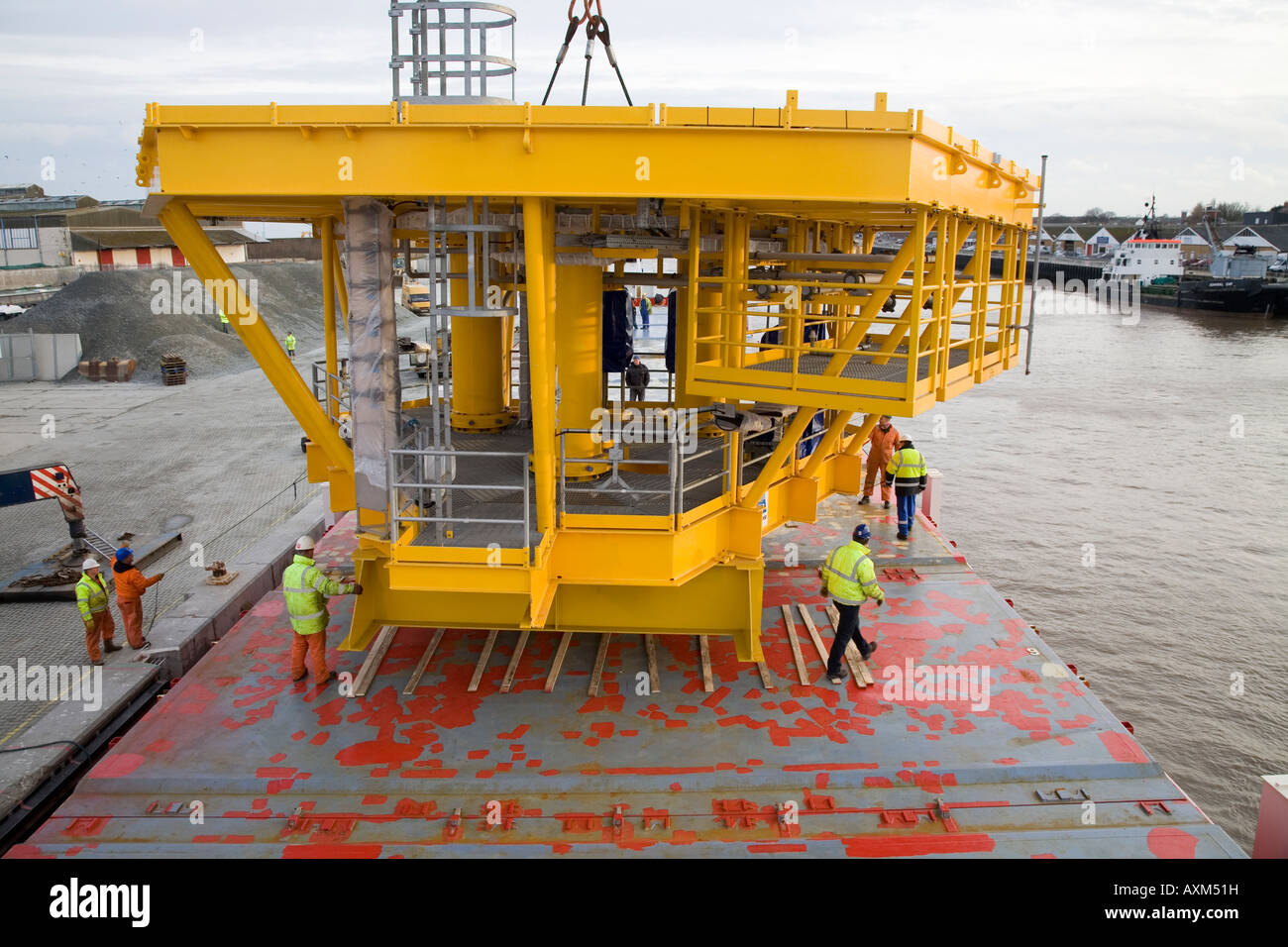Rig platform being loaded onto container ship at Yarmouth Stock Photo ...