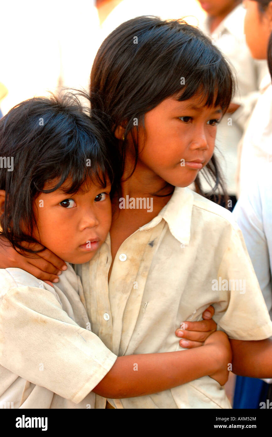 Cambodia ,Tonle Sap Lake , village scene of two pretty young native ...