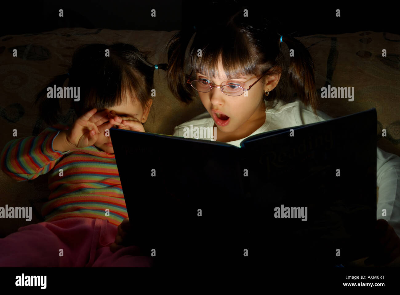 Girl Reading Magic Book Stock Photo - Alamy