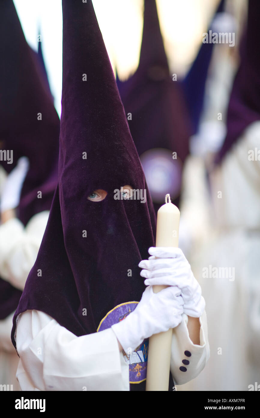 Hooded penitents bearing candles, Holy Week 2008, Seville, Spain Stock ...