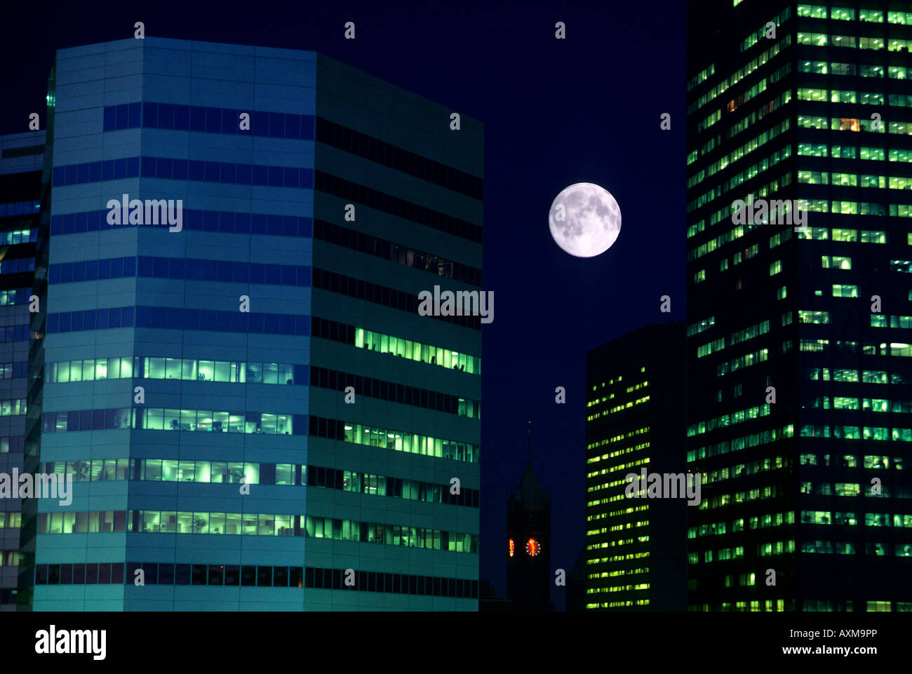 FULL MOON PEEKS THROUGH SKYSCRAPERS IN DOWNTOWN MINNEAPOLIS, MINNESOTA ...