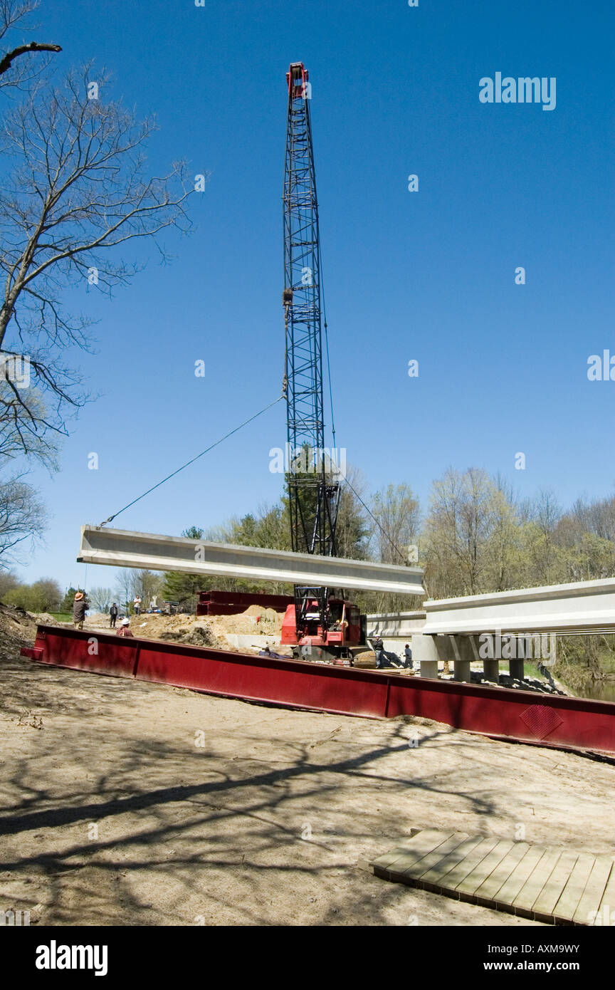 Crane lifting beam for a new bridge Stock Photo - Alamy