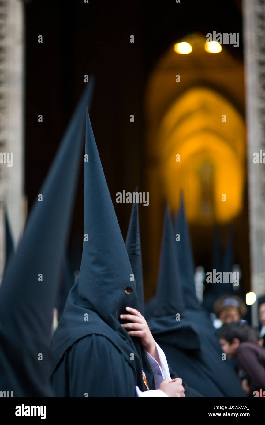 Hooded penitents entering Seville's cathedral, Holy Week 2008 Stock ...