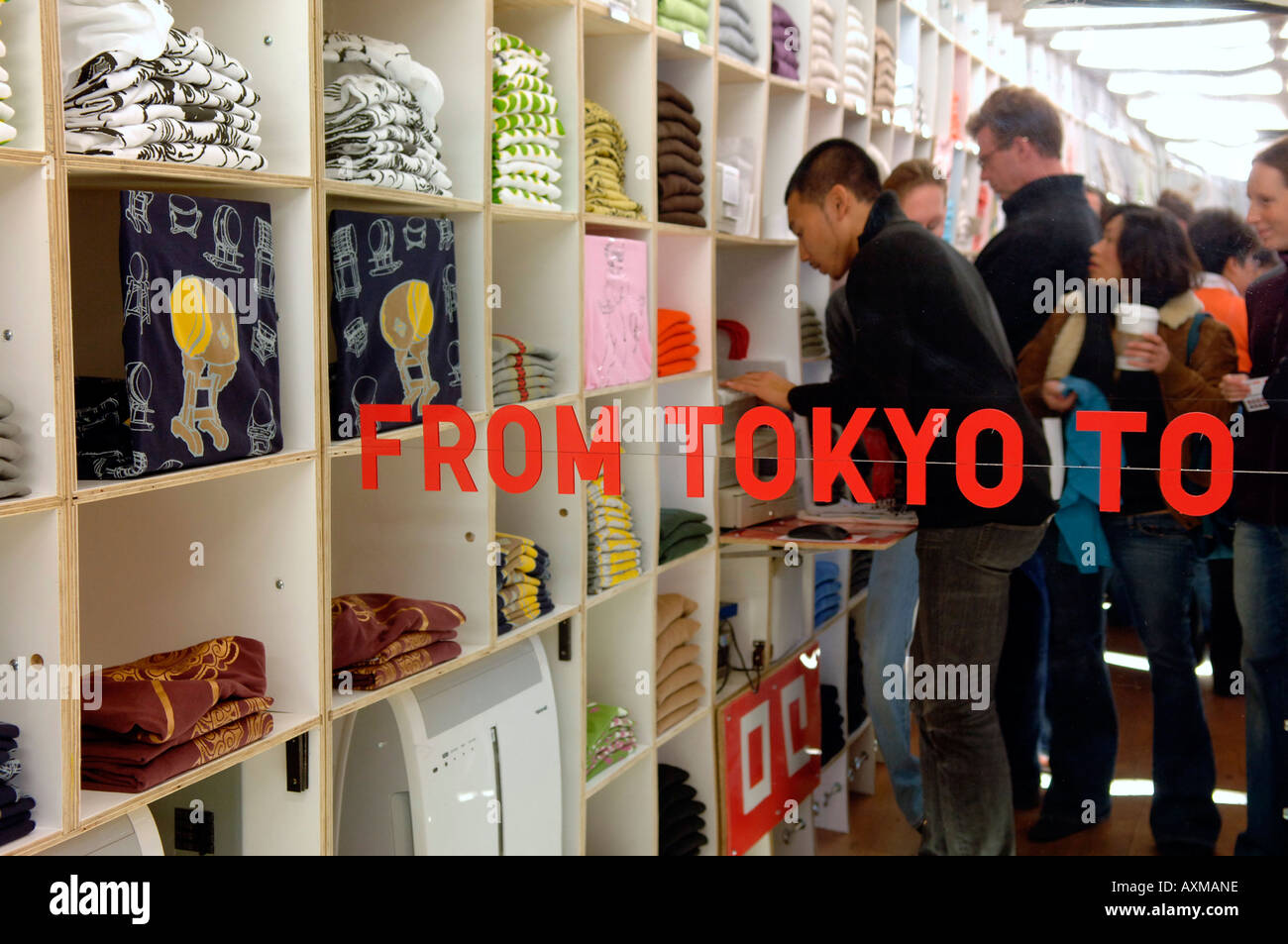 Customers shop at the Uniqlo container store Stock Photo - Alamy