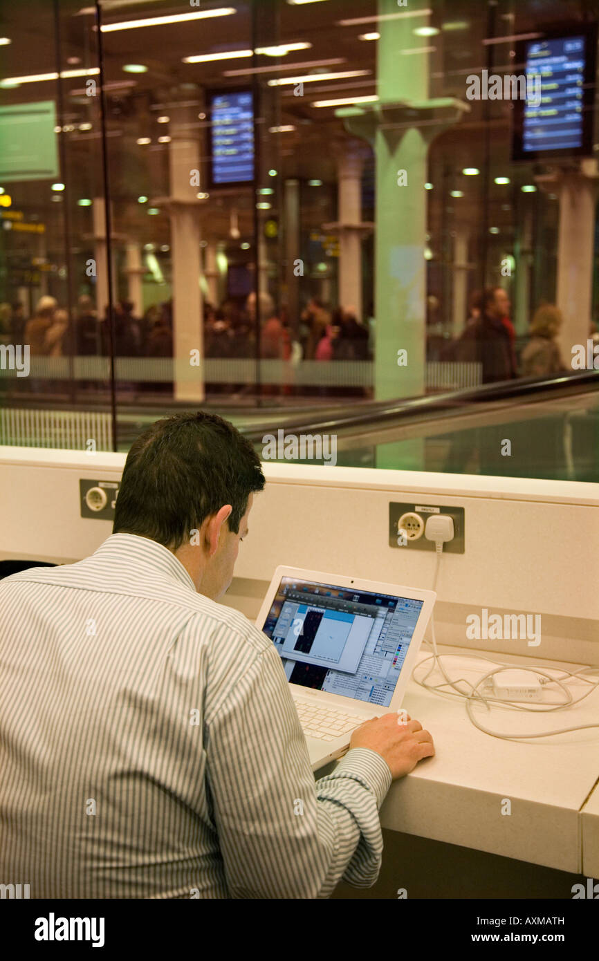 Passengers using wifi internet connection service at International ...